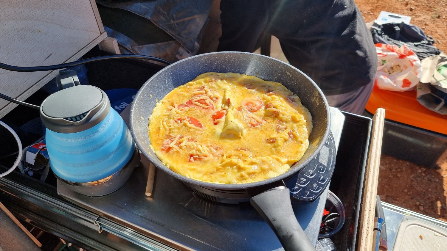 Is 240V cooking a viable option for long-term travel in an RV?