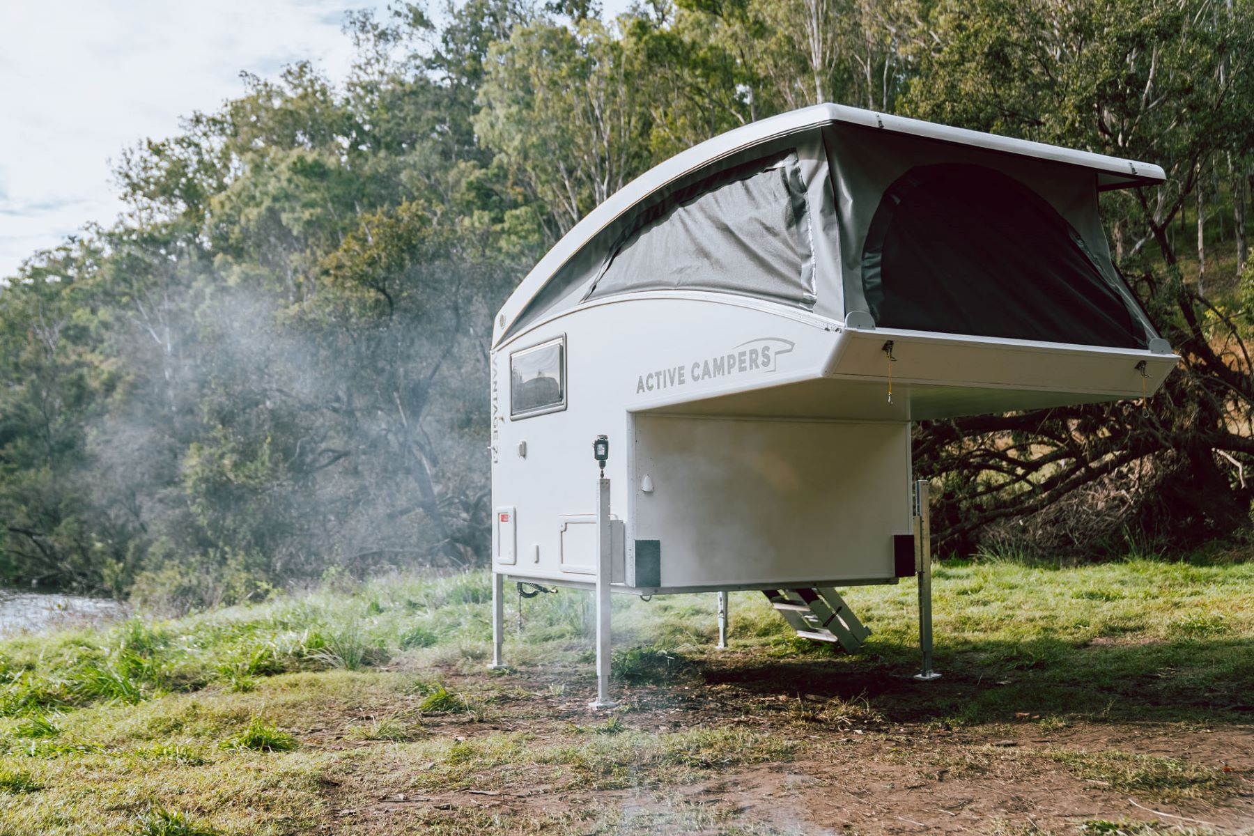 This slide on camper is not only lightweight, but also has an ensuite